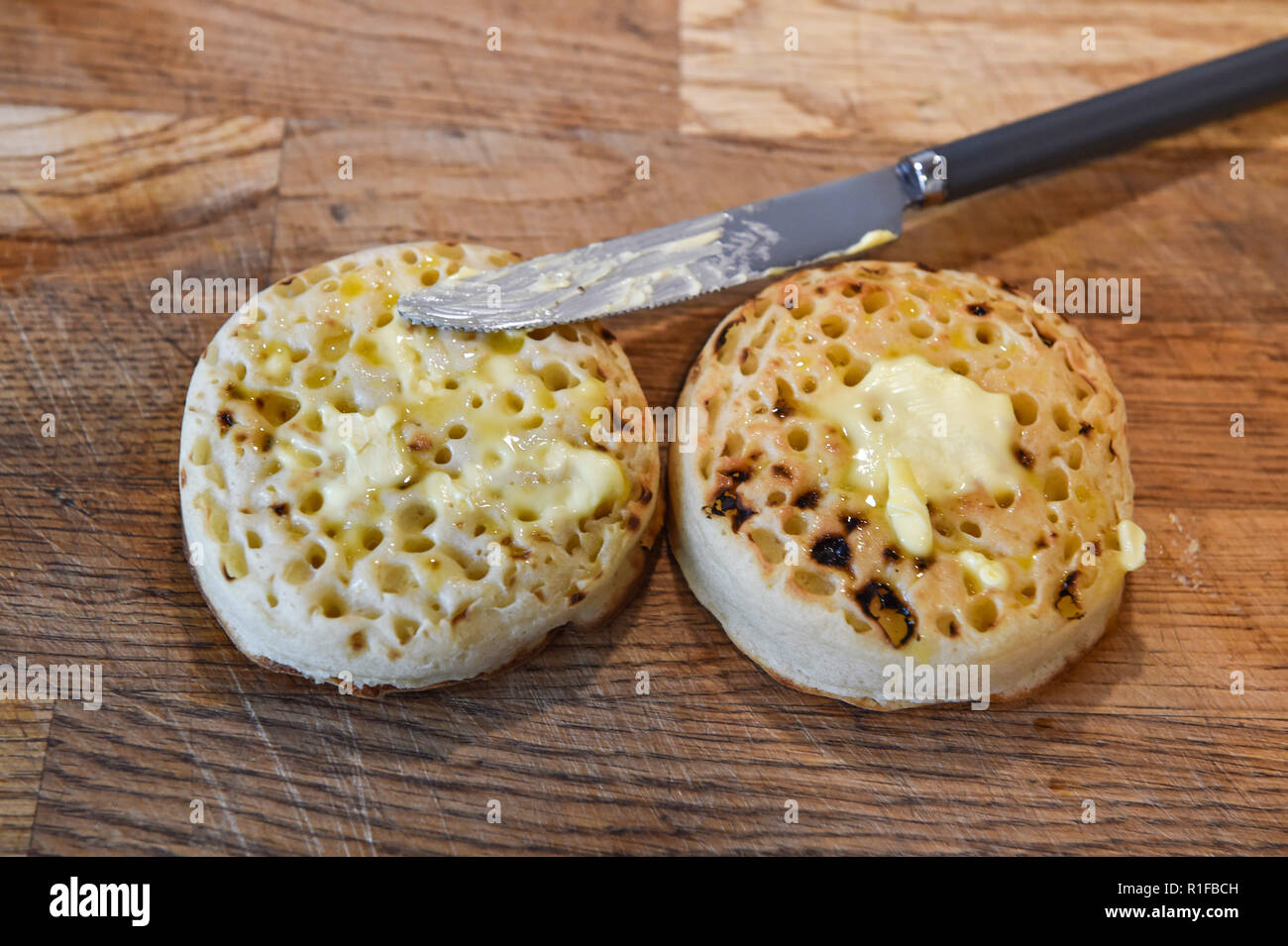 Toasted hot crumpets with butter for breakfast Photograph taken by ...