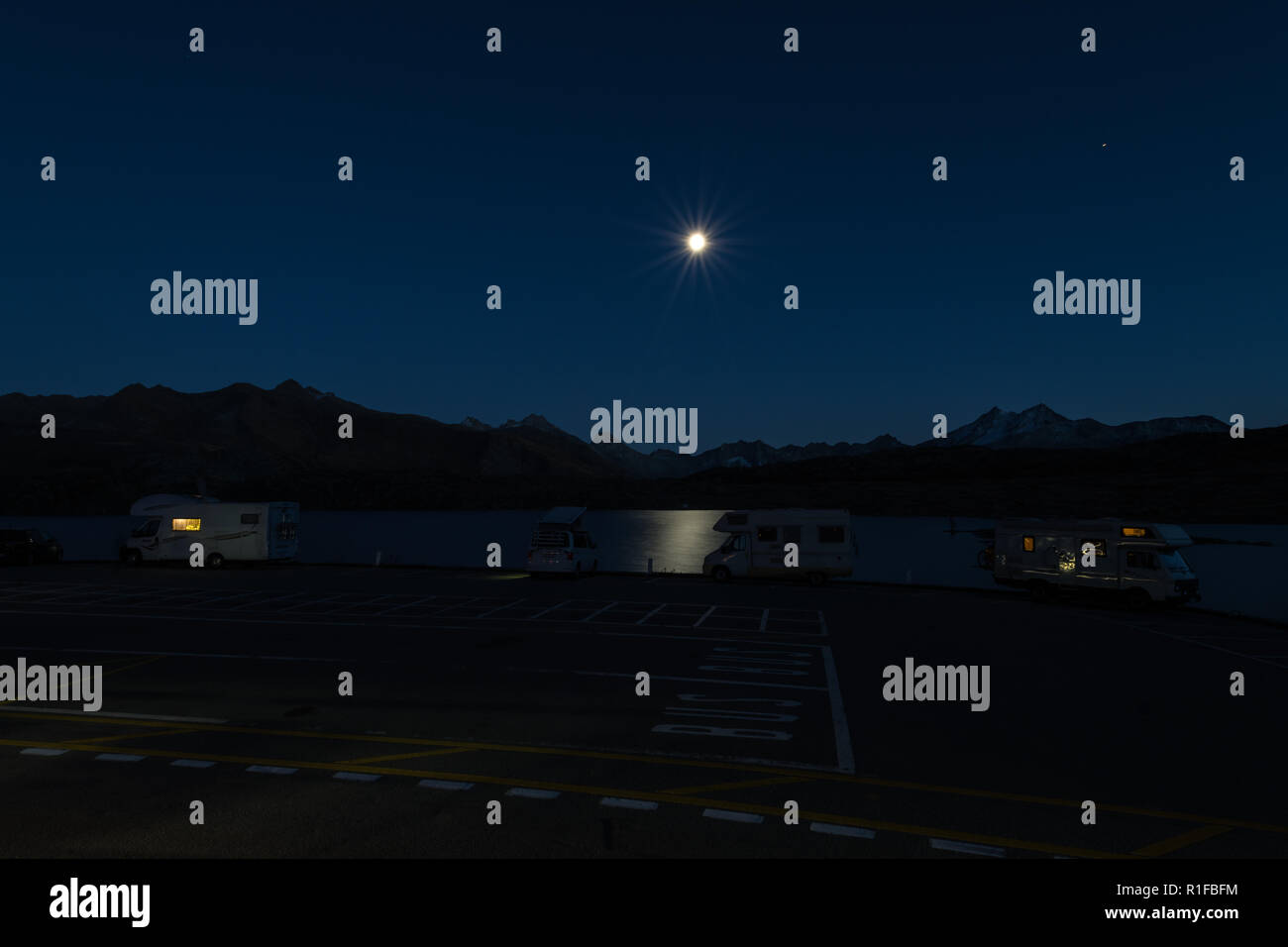 Mobile homes at night in the swiss alps Stock Photo - Alamy