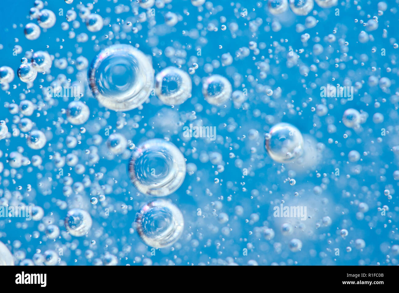 Bubbles of oxygen under water. Water blue structure. Macro Stock Photo ...