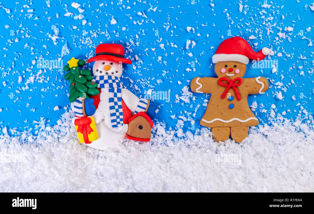 snowman and ginger man in the snow, festive background Stock Photo - Alamy