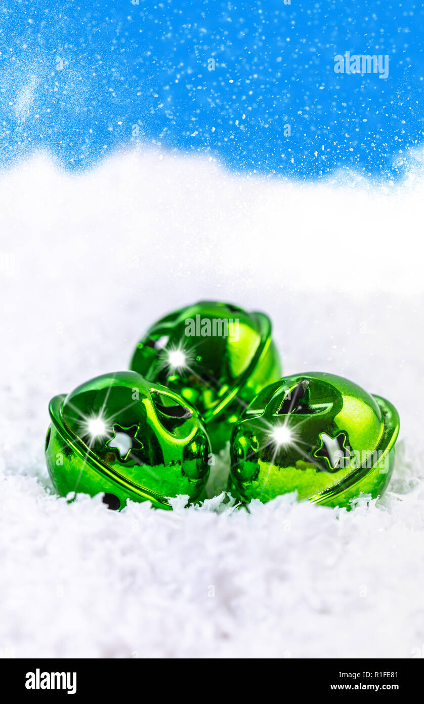 Christmas bells in the snow, festive background Stock Photo - Alamy
