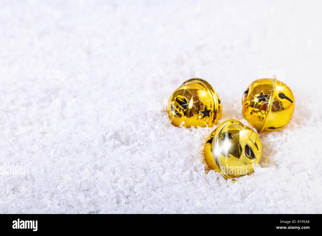 Christmas bells in the snow, festive background Stock Photo - Alamy