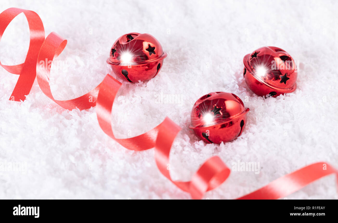 Christmas bells in the snow, festive background Stock Photo - Alamy