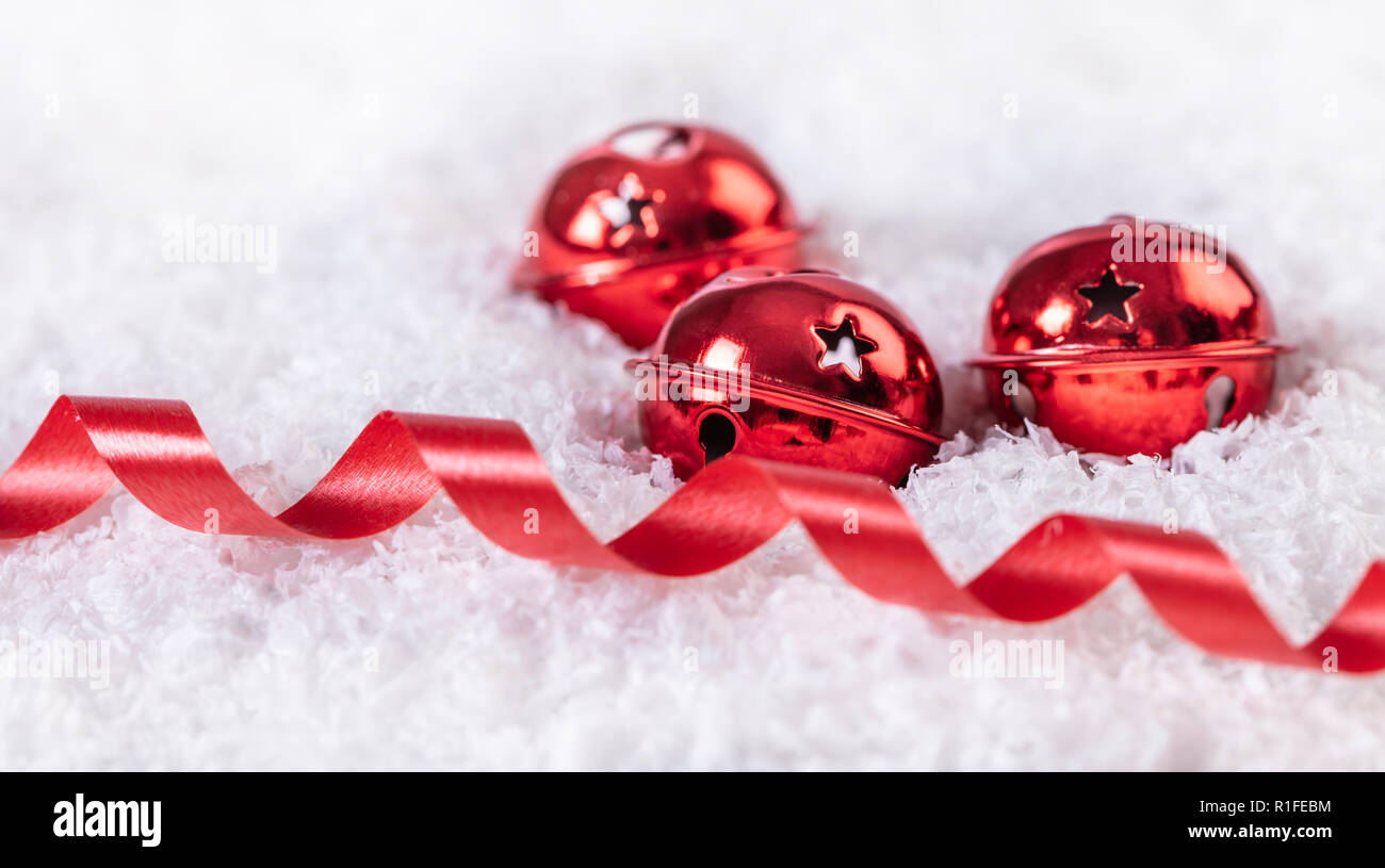 Christmas bells in the snow, festive background Stock Photo - Alamy