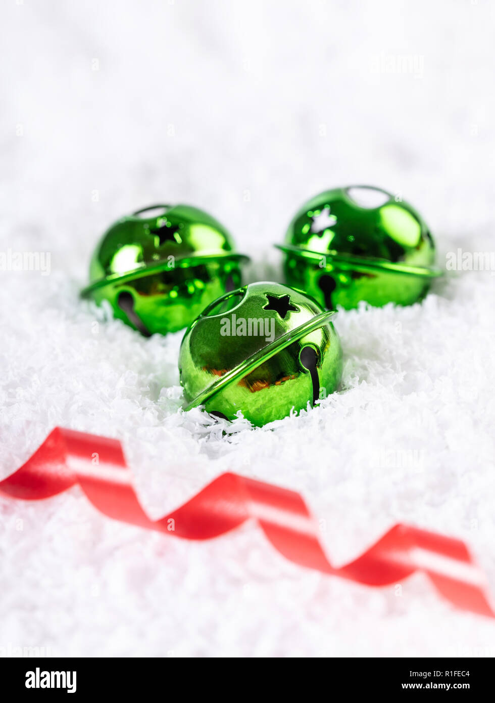 Christmas bells in the snow, festive background Stock Photo - Alamy