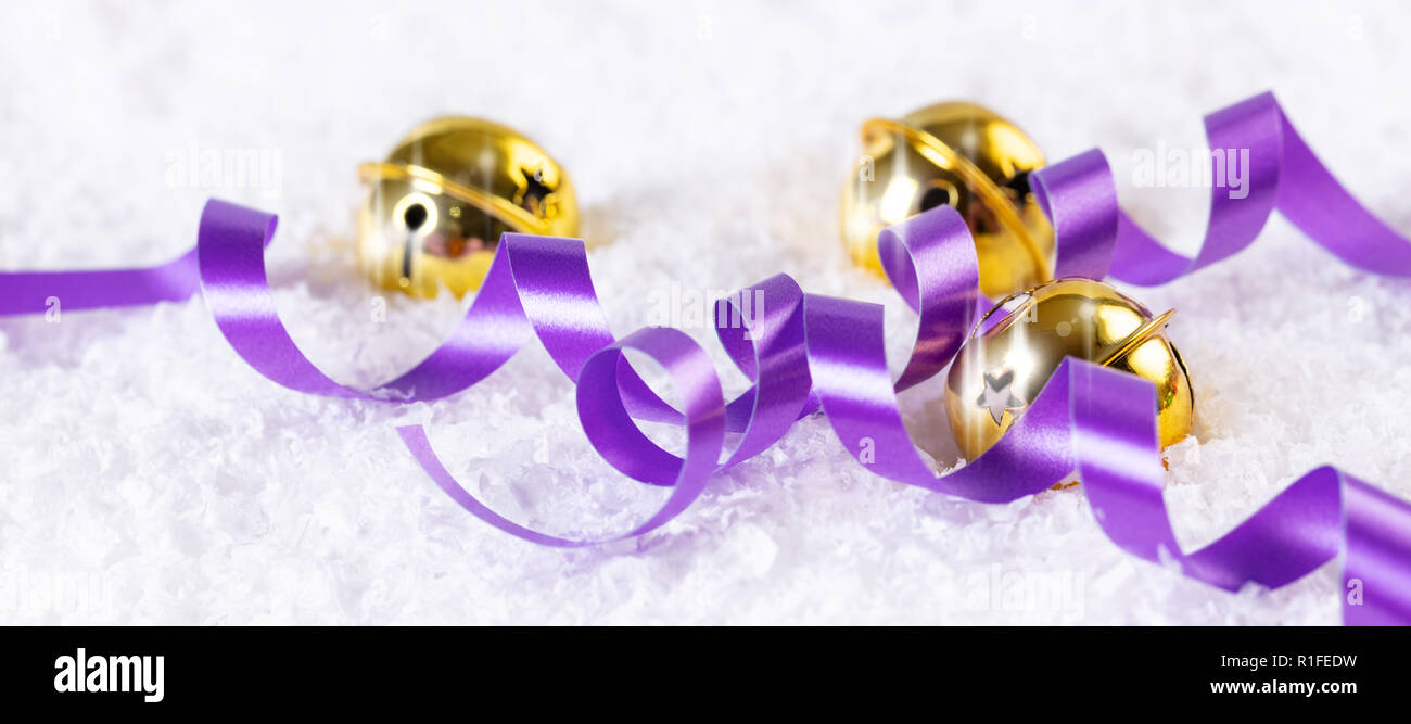 Christmas bells in the snow, festive background Stock Photo - Alamy