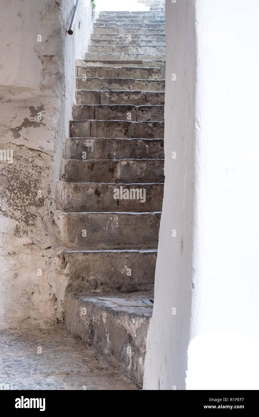 Narrow arched passageway with steps in the town of Amalfi on the Amalfi ...