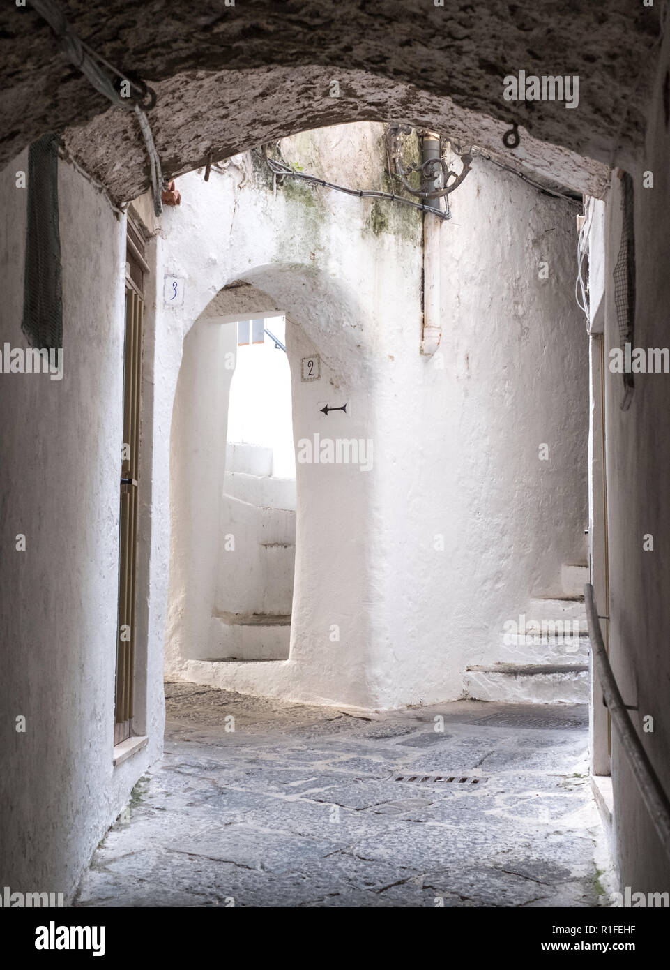 Narrow arched passageway with steps in the town of Amalfi on the Amalfi ...