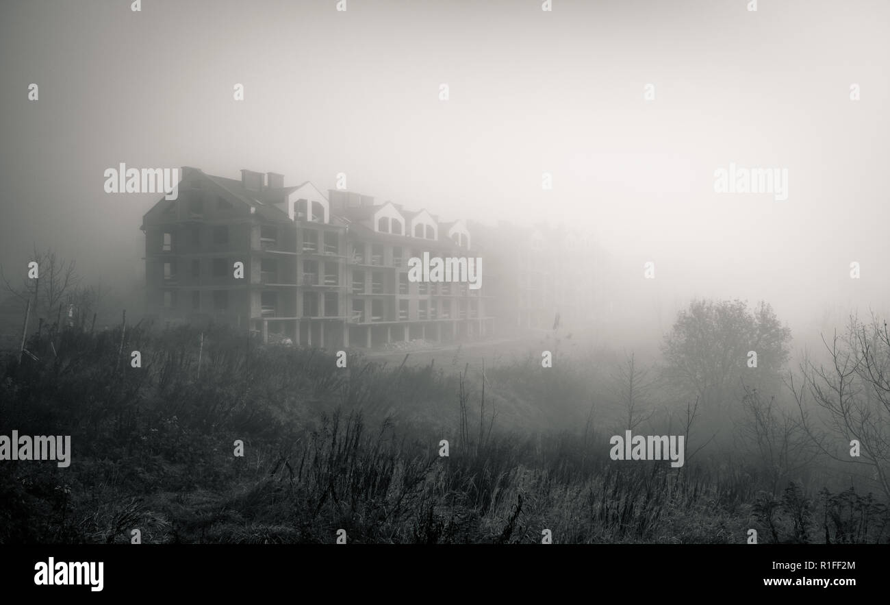 Abandoned construction site in a remote fog ridden location Stock Photo ...