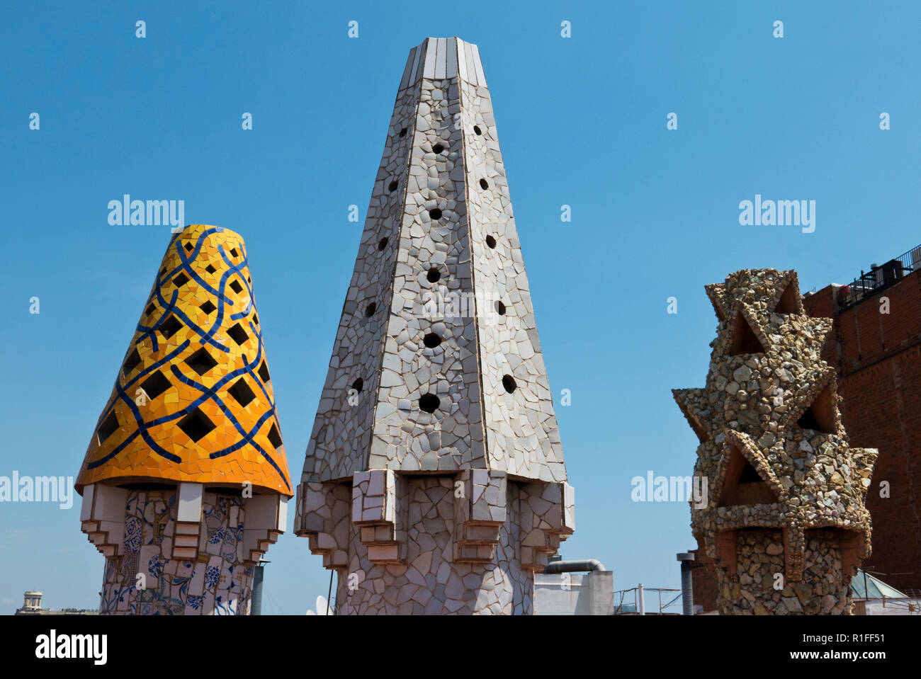 Bright coloured obelisk on the rooftop of the Palau Guell house ...