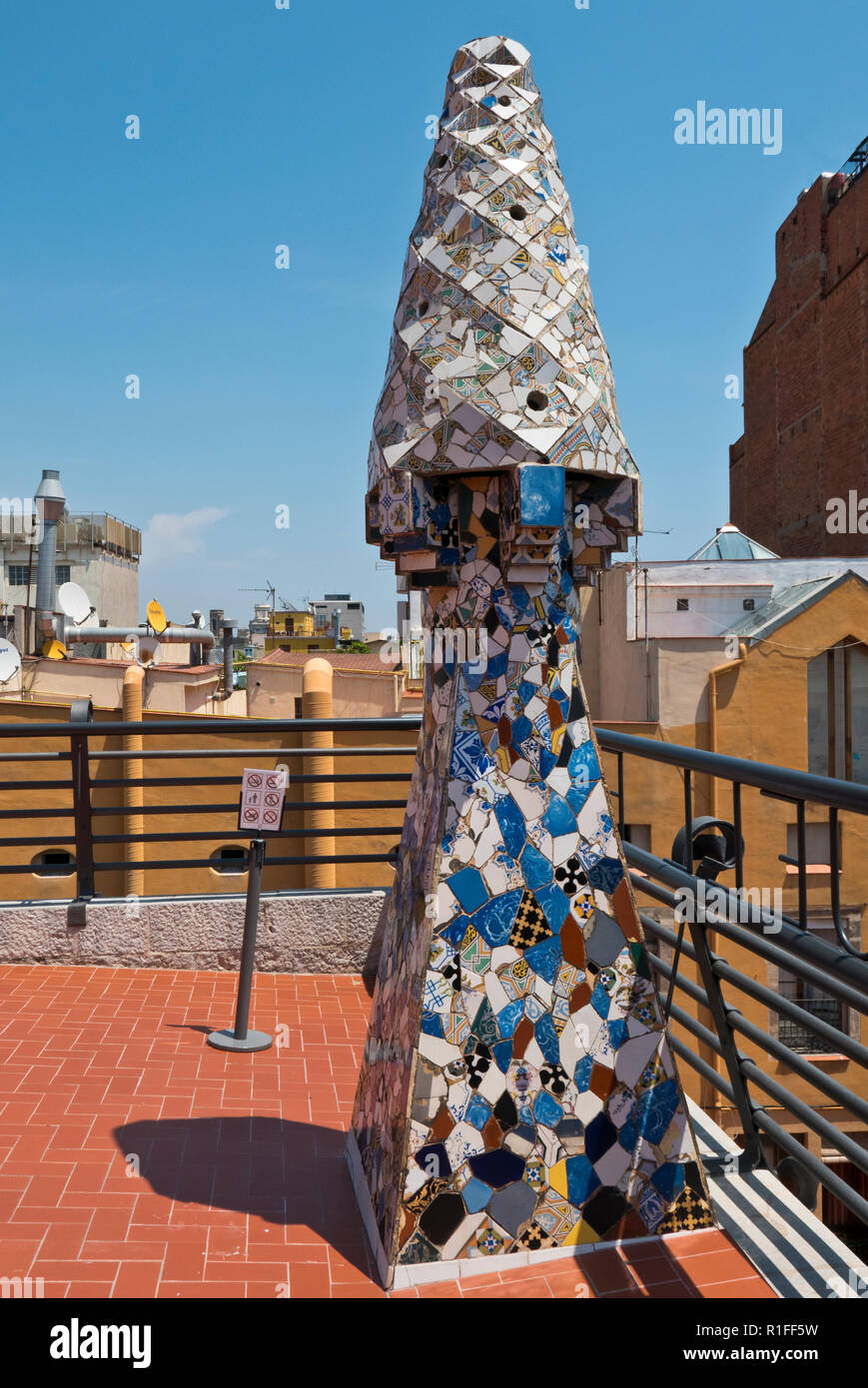 Bright coloured obelisk on the rooftop of the Palau Guell house ...