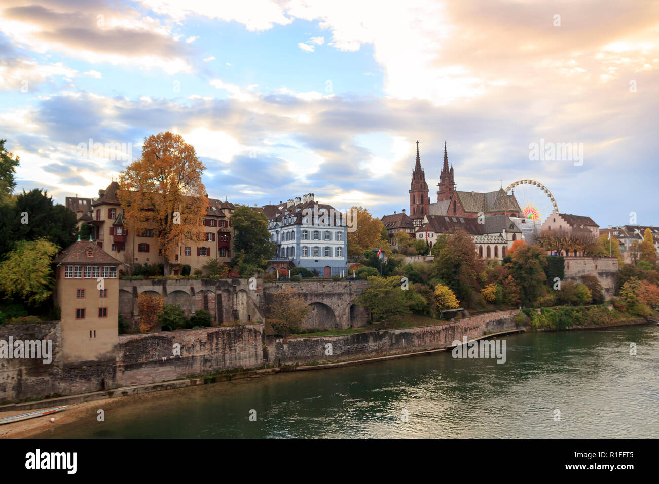 Basel Munster in the river Rhine, at the autumn fair with the ferris ...