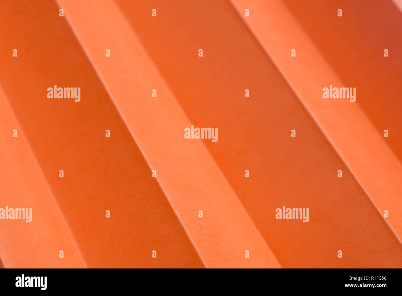 orange sheet of paper folded background texture Stock Photo - Alamy
