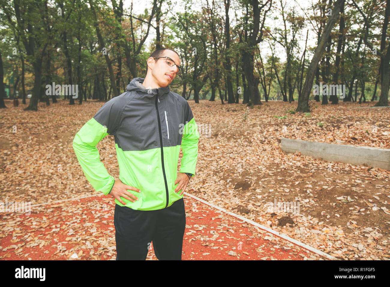 Fitness young man workout at park in autumn morning. Healthy man doing ...