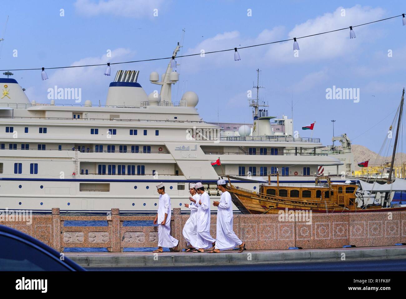 Muscat, France. 19th Nov, 2012. Four young Omanis walk in white ...