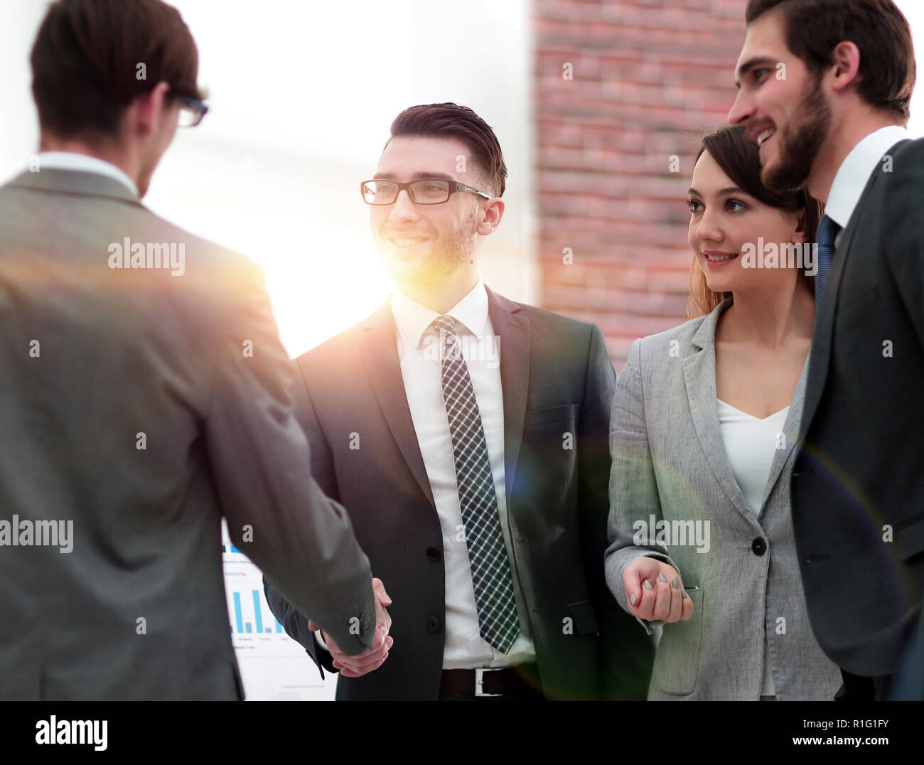 Confident young people, handshake and smile Stock Photo - Alamy