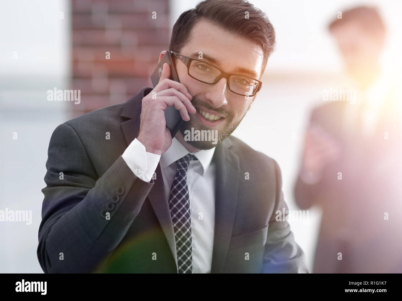 image of young businessman talking on mobile phone with clients Stock ...