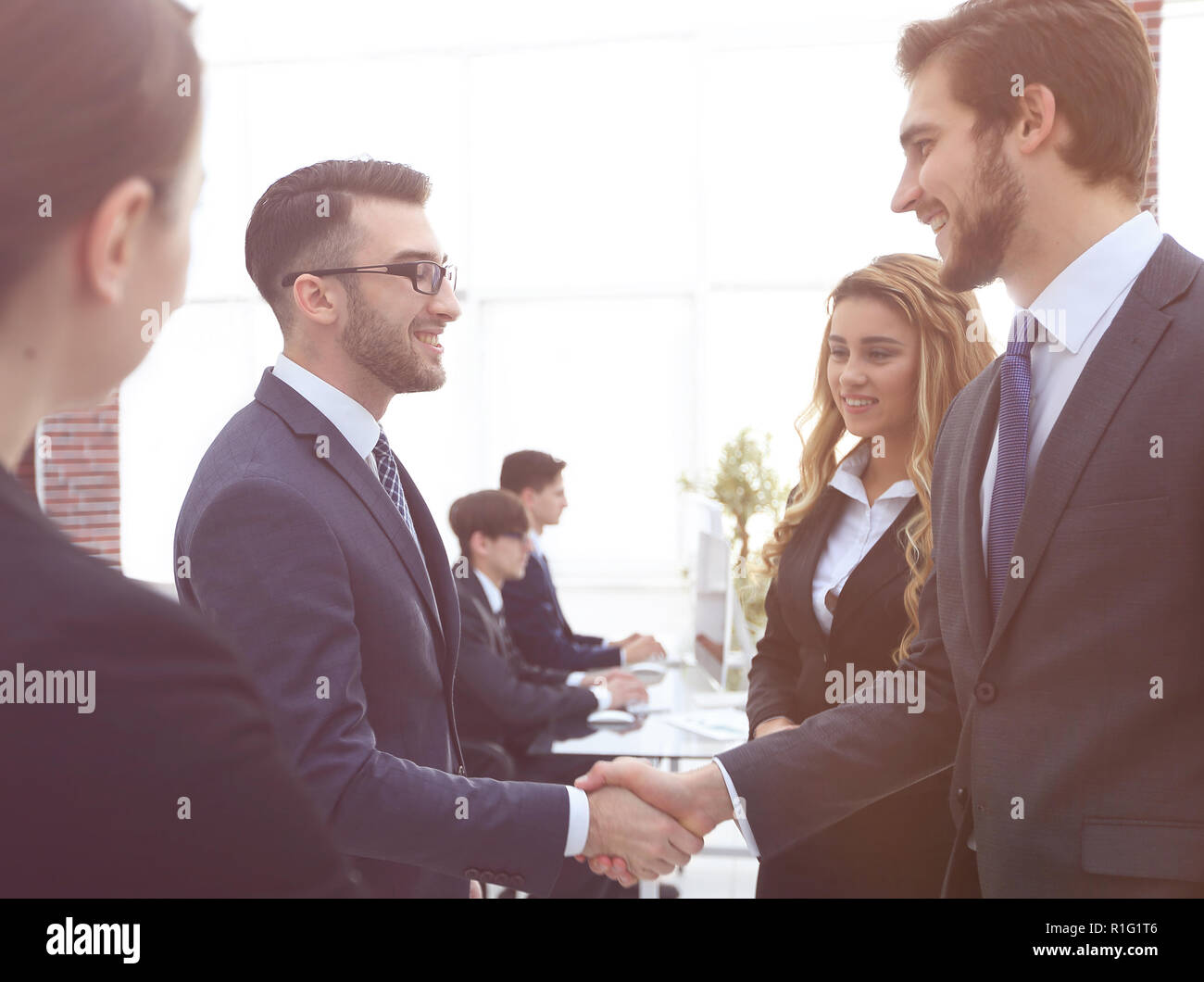handshake business partners in the office Stock Photo - Alamy