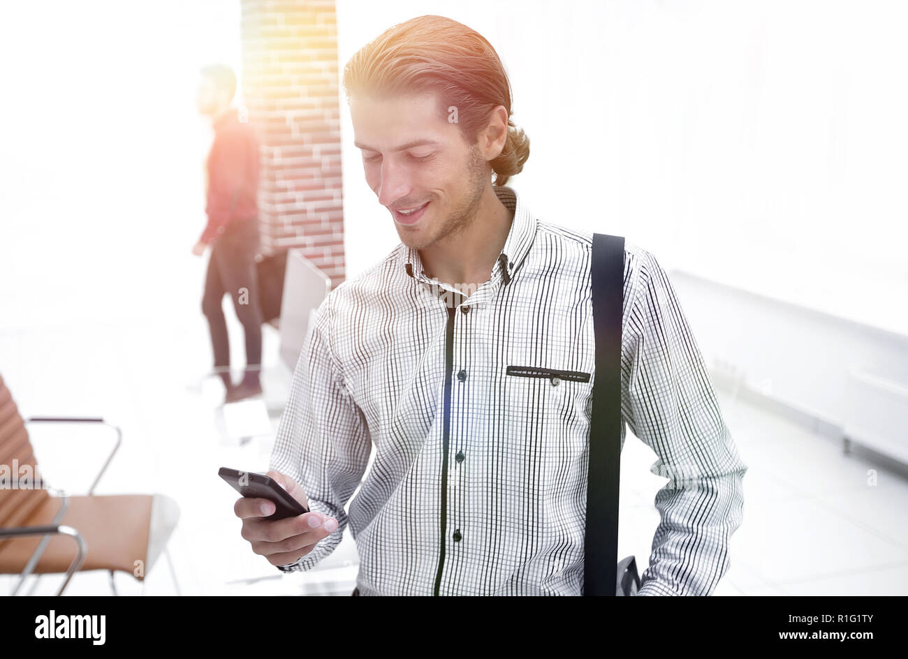 employee reads a text message on smartphone Stock Photo - Alamy