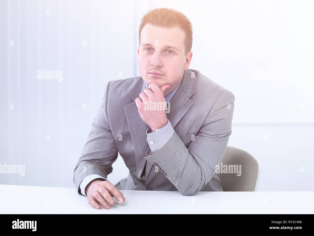 Boss sitting behind desk standing hi-res stock photography and images ...