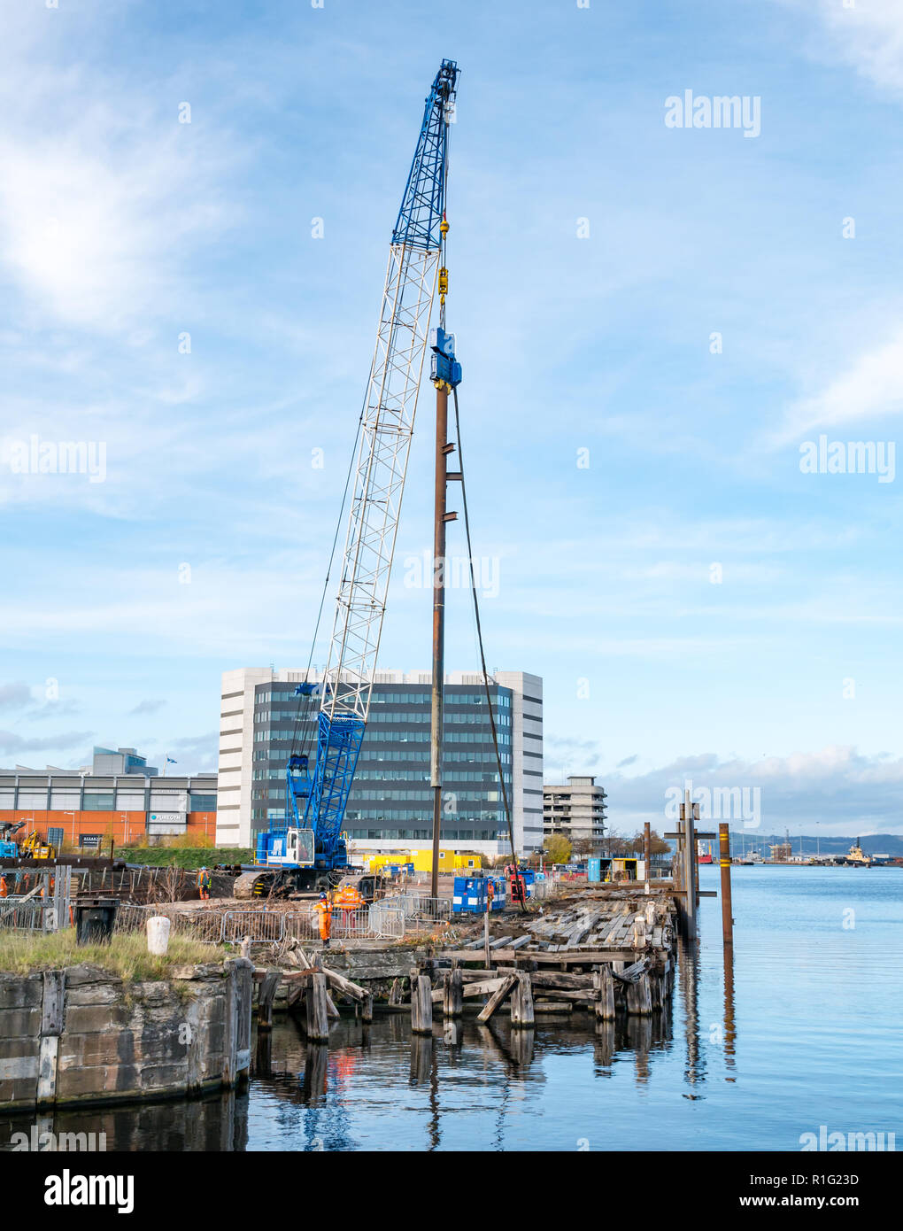 Workmen on Skyliner construction site by S1 Developments with crane ...