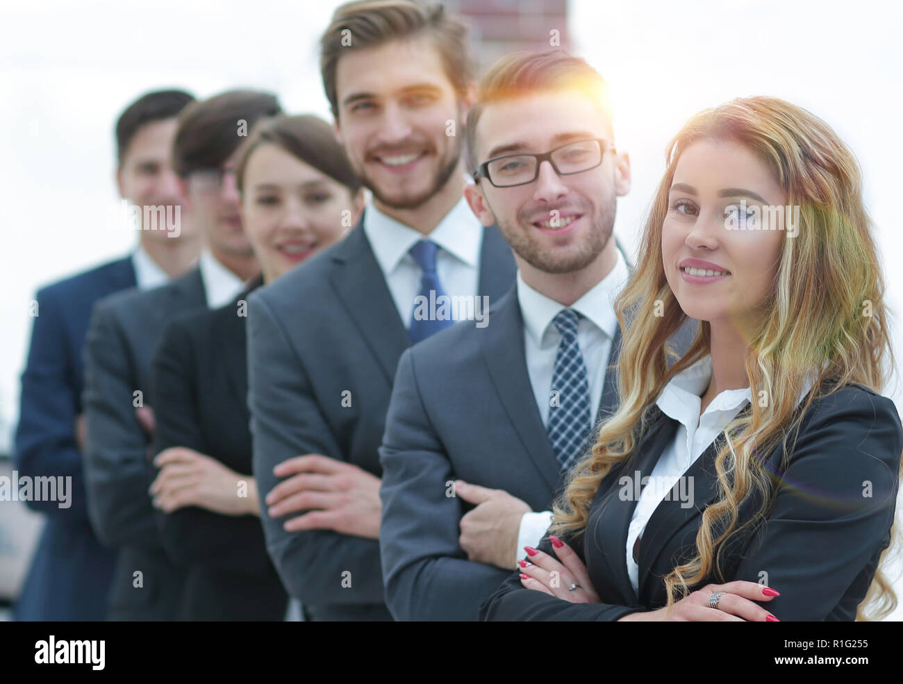 business team in the background of the office Stock Photo - Alamy