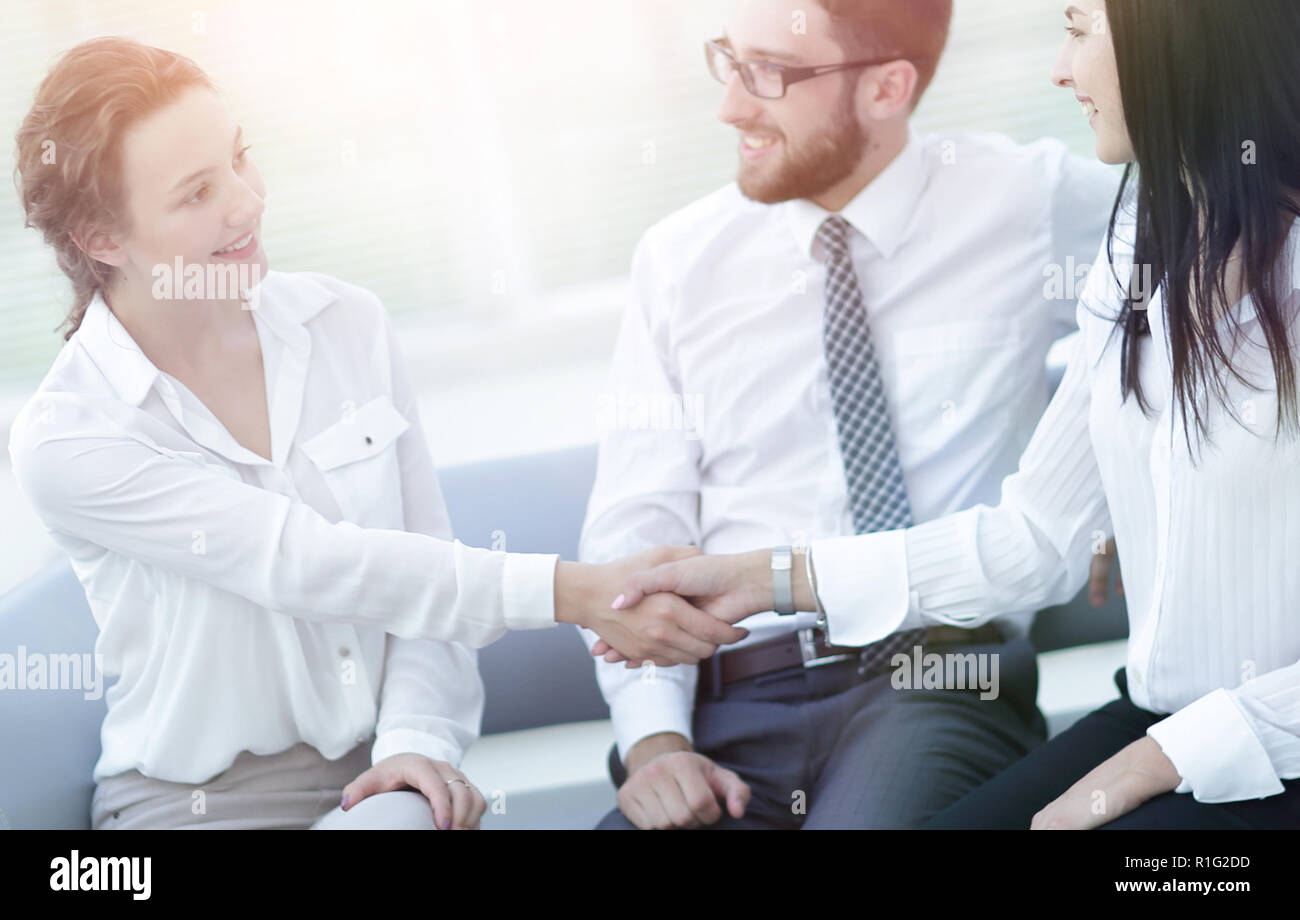 handshake of manager and client in the office lobby Stock Photo - Alamy