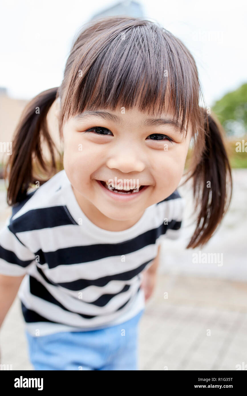 Japanese kid in a city park Stock Photo - Alamy