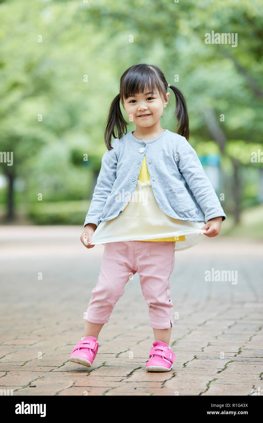 Japanese kid in a city park Stock Photo - Alamy