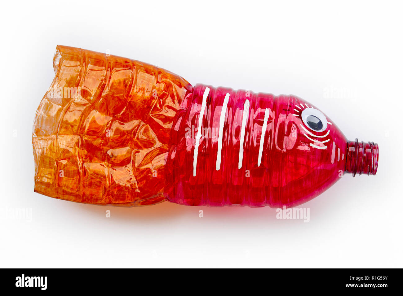 Plastic bottle recycled in a fish figure. Reuse garbabe. Isolated Stock ...
