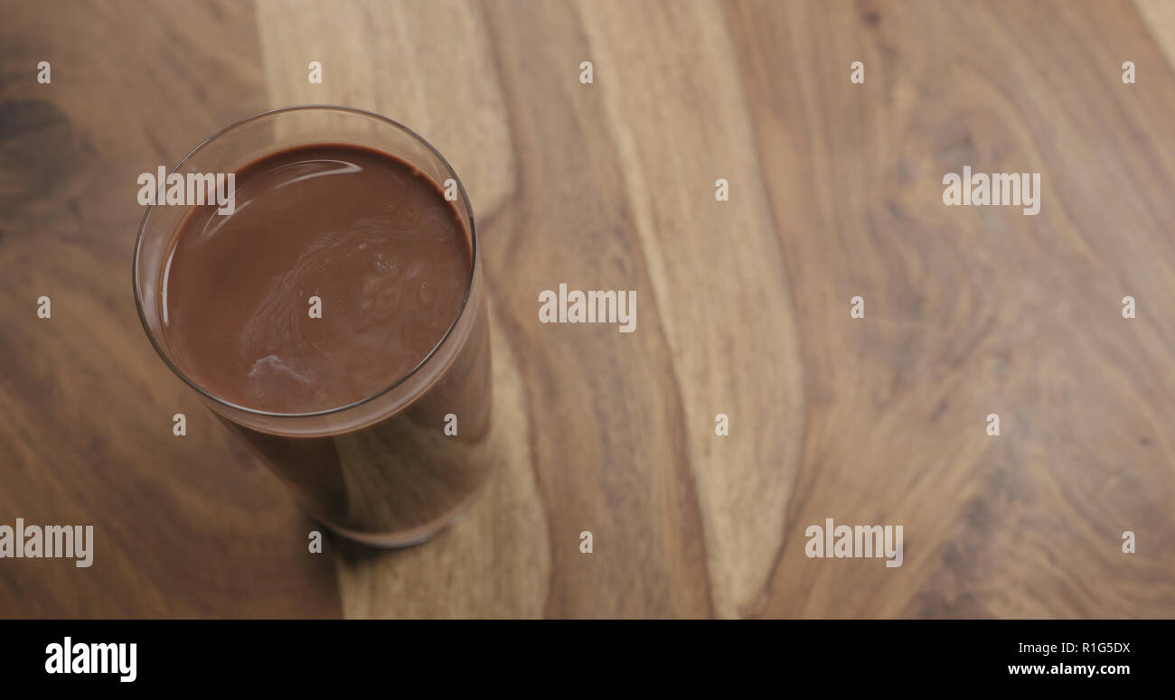 Hot cocoa in glass on wood background with copy space, wide photo Stock ...