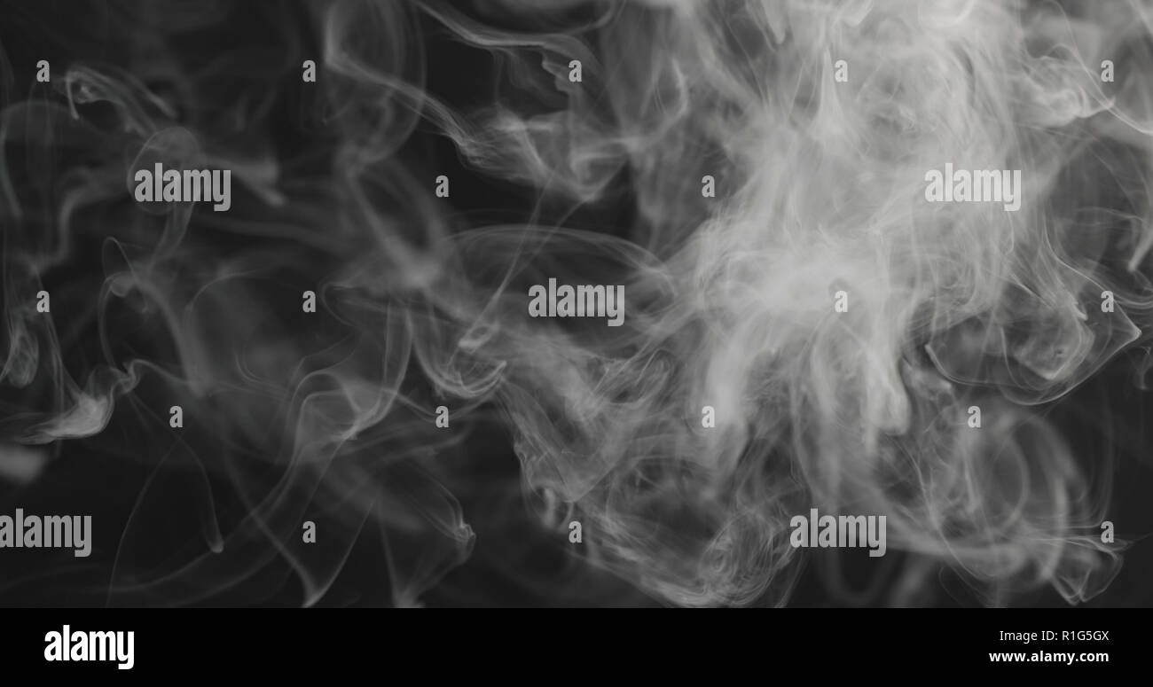 closeup vapor rises from bottom on black background, wide photo Stock ...