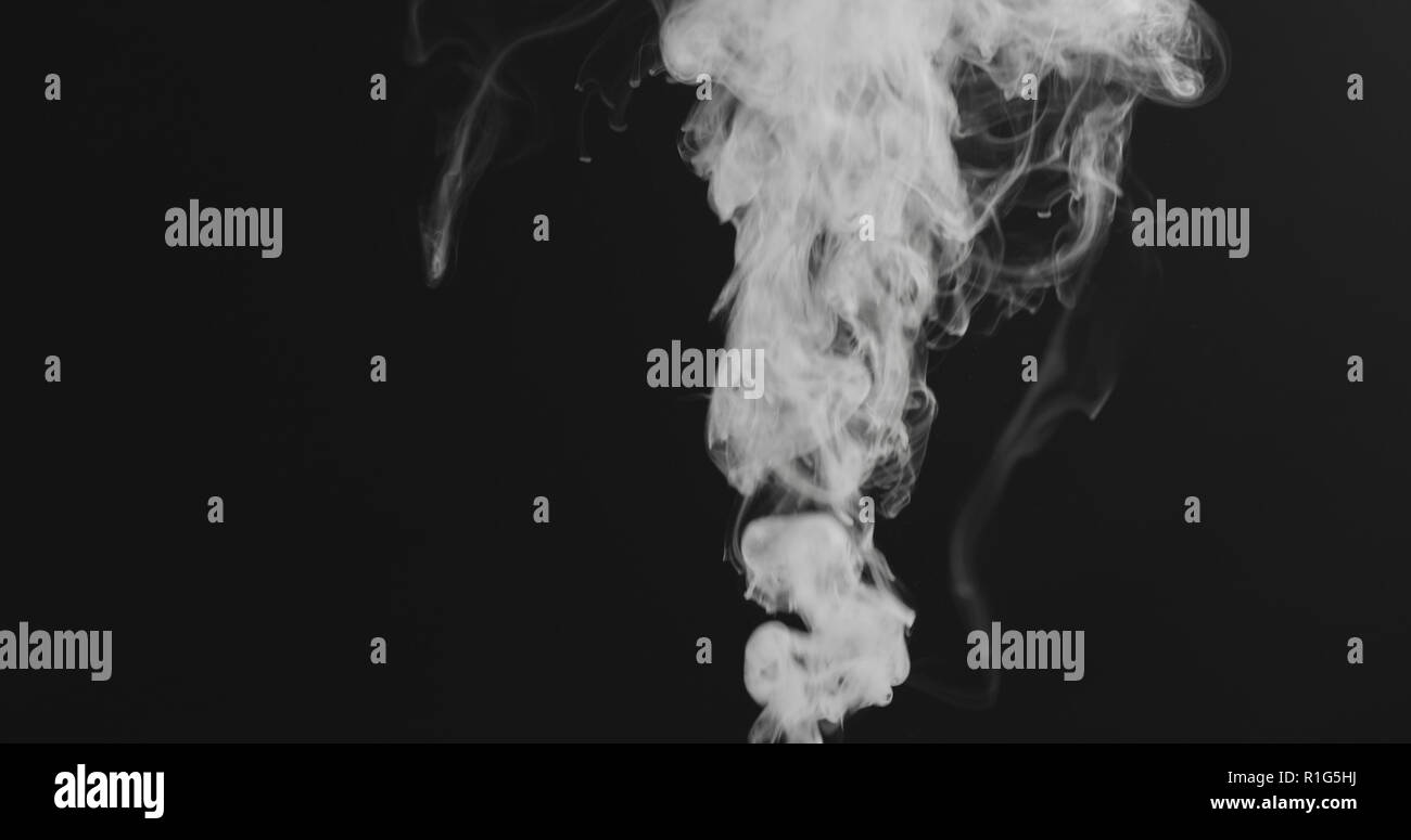 closeup vapor stream rises from bottom center on black background, wide ...