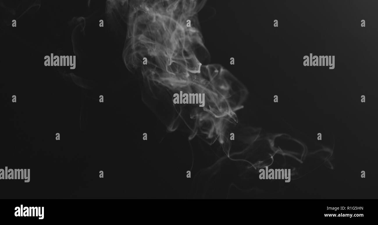 closeup vapor stream rises from bottom center on black background, wide ...
