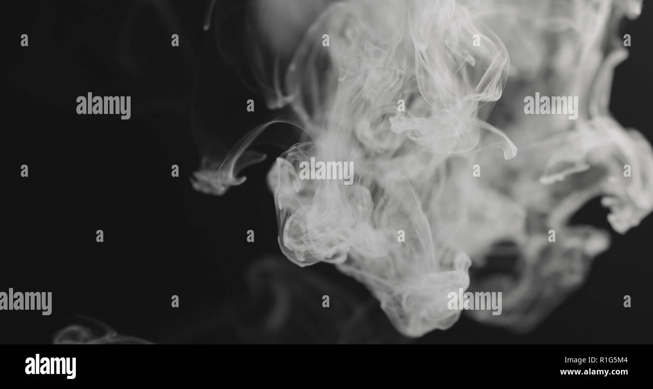 closeup vapor stream from top on black background, wide photo Stock ...