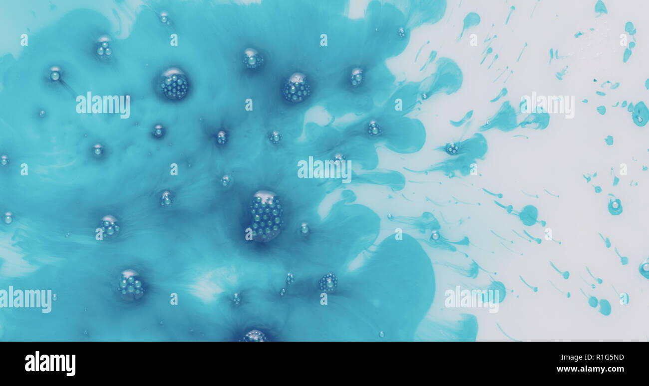 blue ink drops spreads on white plastic background, wide photo Stock ...