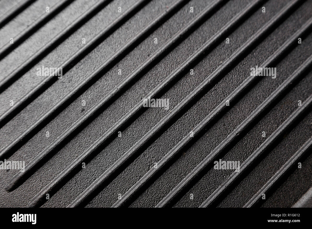 ribbed surface of a black frying pan grill closeup. space for text ...