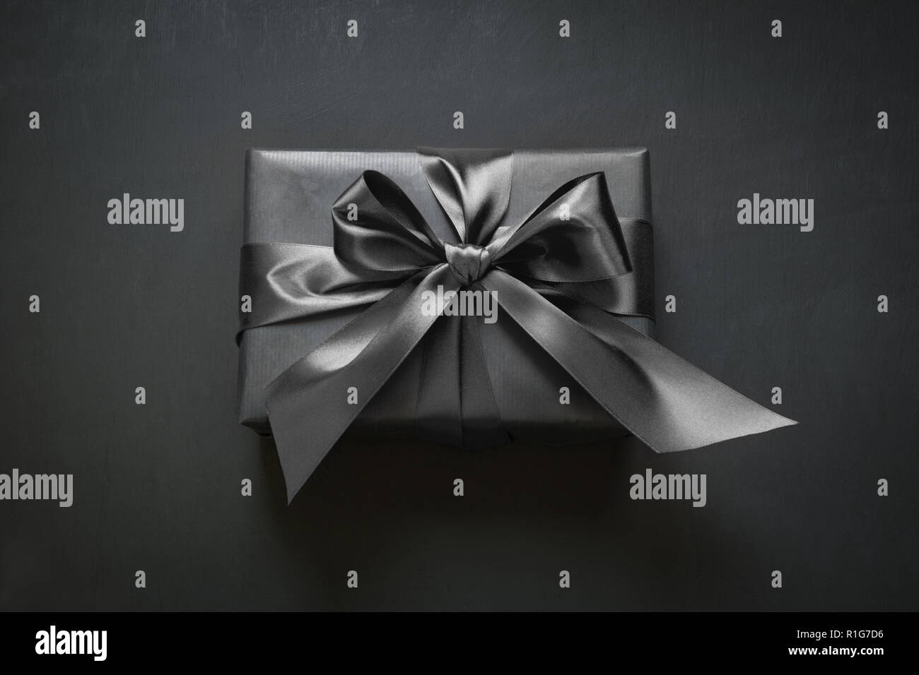 Gift box wrapped in black ribbon. Top view Stock Photo - Alamy