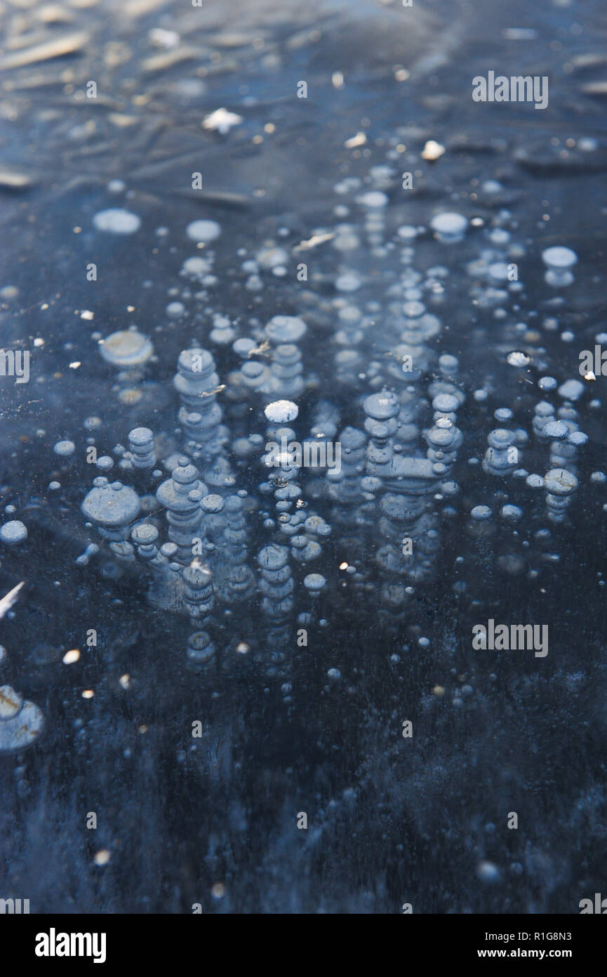 Air bubbles frozen in the water in a bizarre form Stock Photo - Alamy