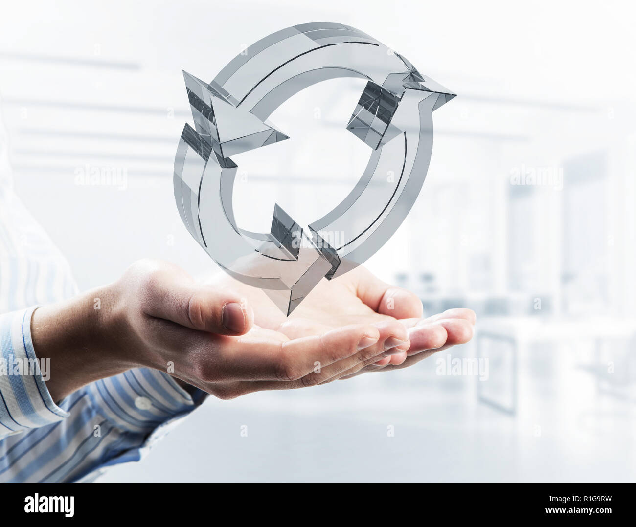 Web refresh icon in male hands as symbol for internet use. Mixed Stock ...