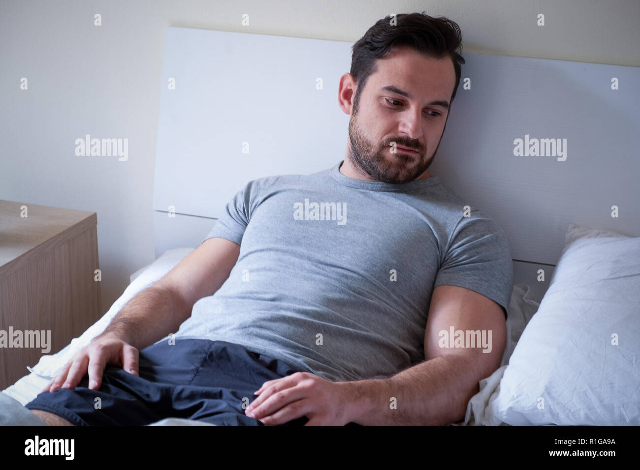 Portrait sad man lying in hi-res stock photography and images - Alamy