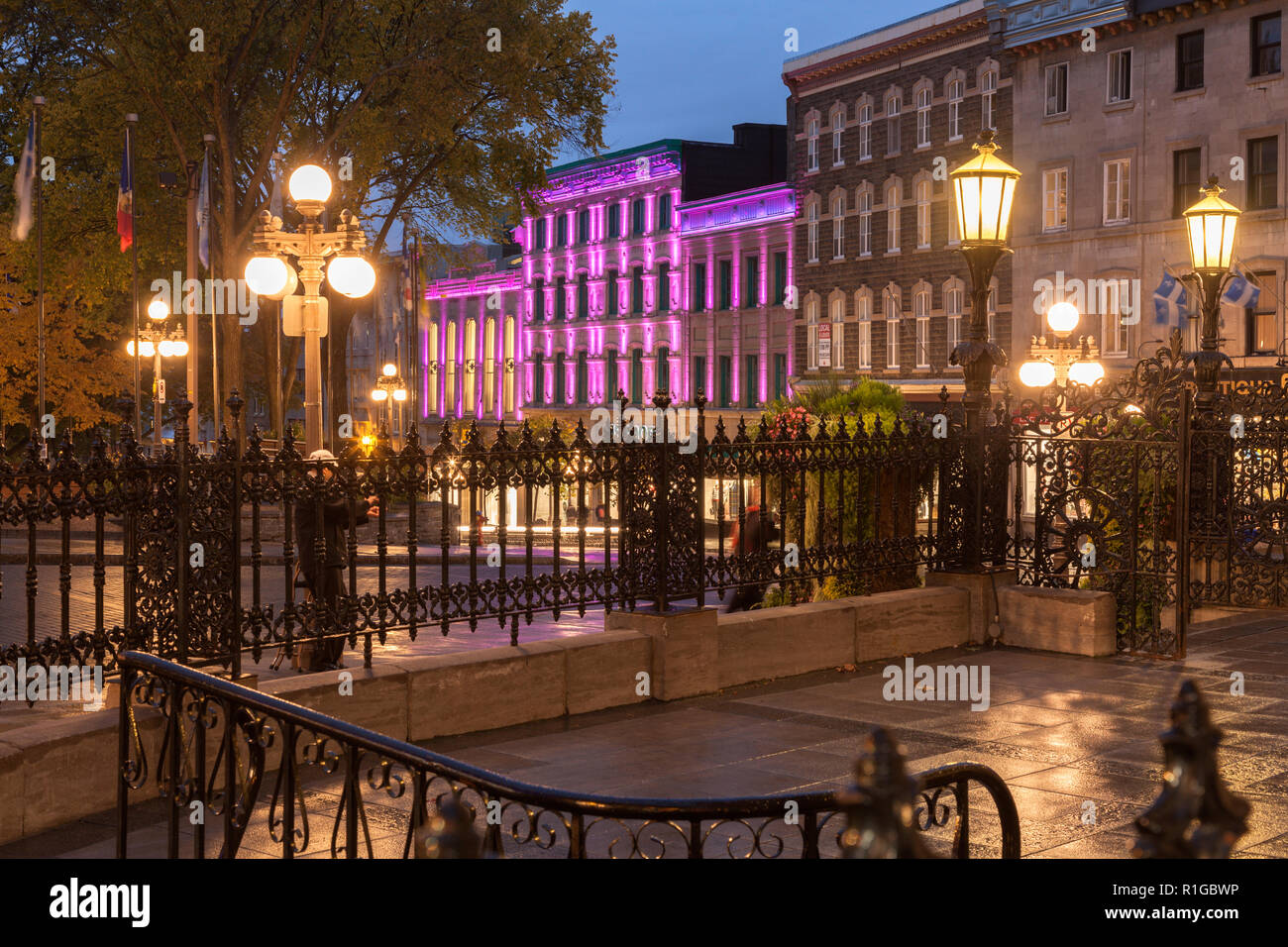 Historical buildings along Côte de la Fabrique at dusk in Old Québec ...