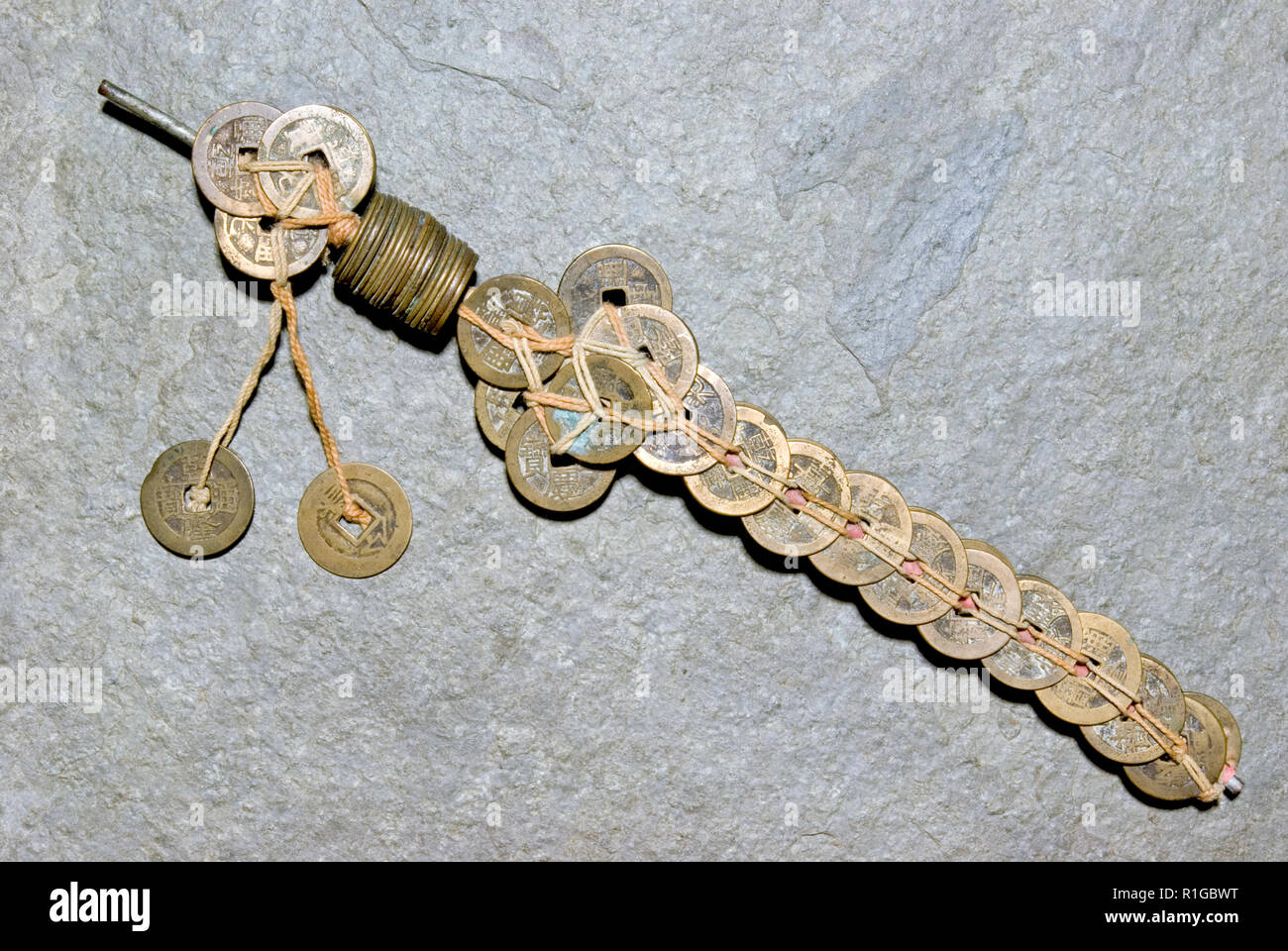 Old Feng Shui Protective Coin Sword Charm Stock Photo - Alamy