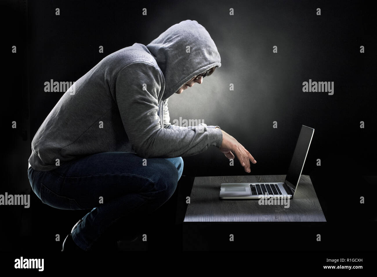 Silhouette of a man sitting on chair hi-res stock photography and ...