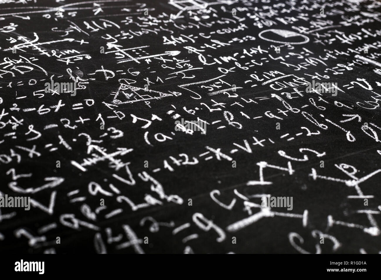 Blackboard inscribed with scientific formulas and calculations in ...