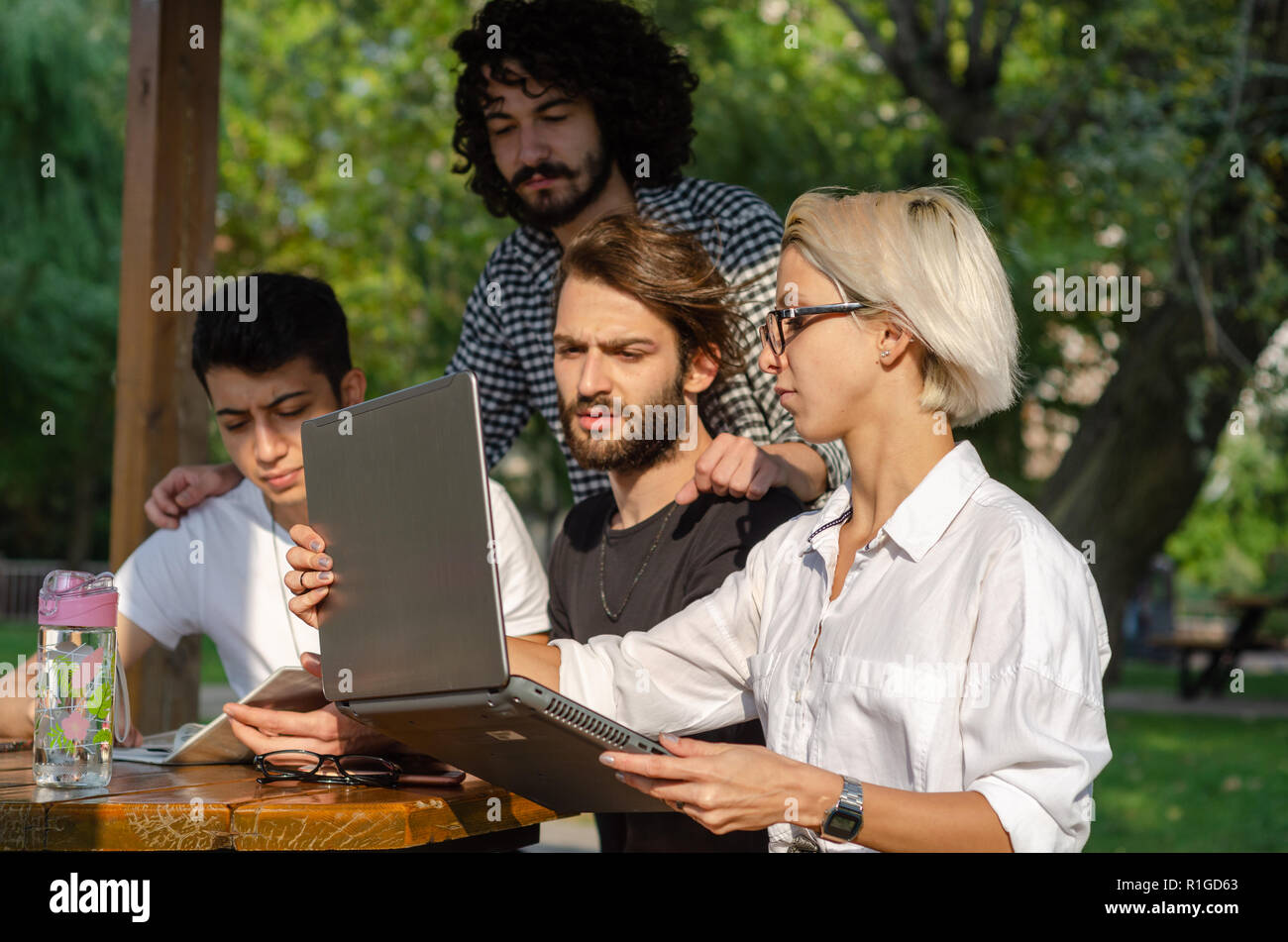 Group working with laptops hi-res stock photography and images - Alamy