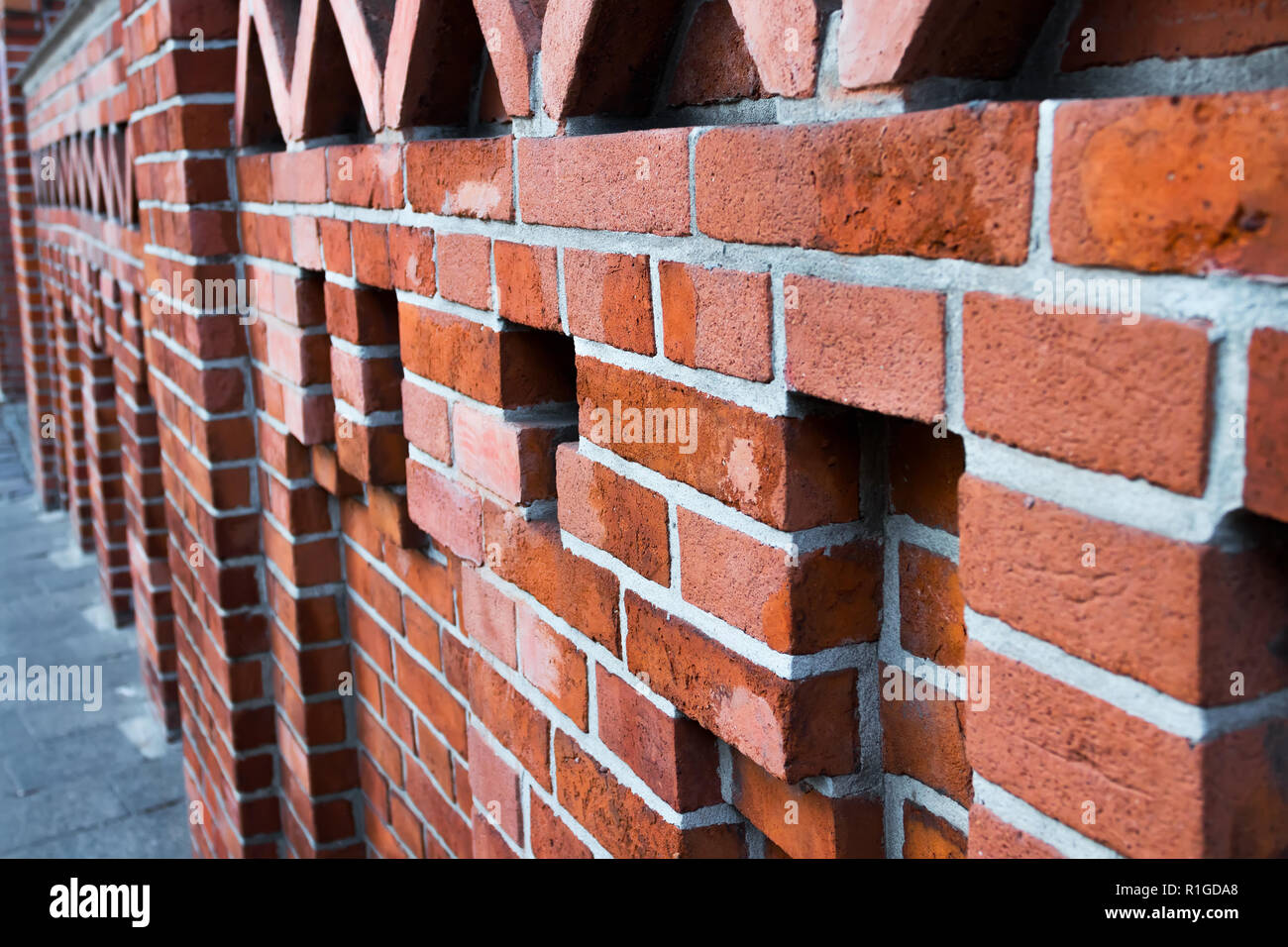 Medieval renovated clean red brick wall Stock Photo - Alamy