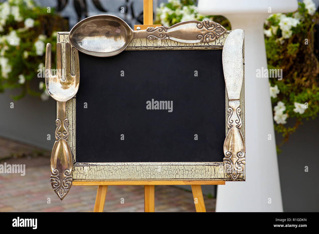 decorative frame for the menu with cutlery at the edges. space for text ...