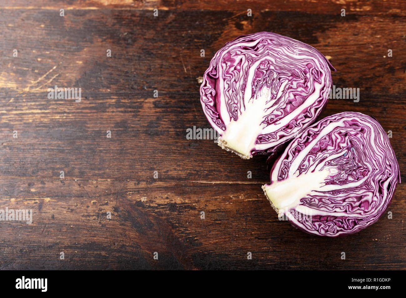 purple cabbage cut in half on wooden background. space for text Stock ...