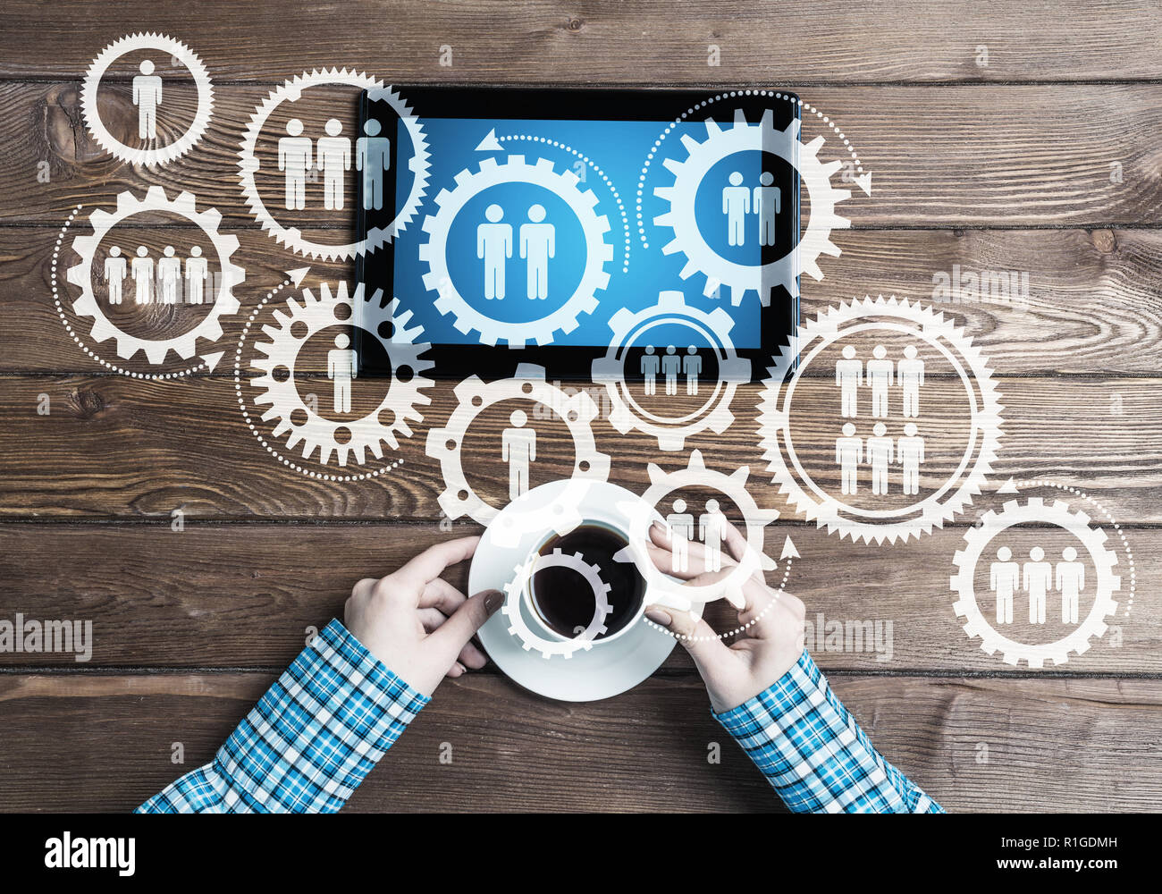 Concept of teamworking and connection with gears mechanism and tablet ...